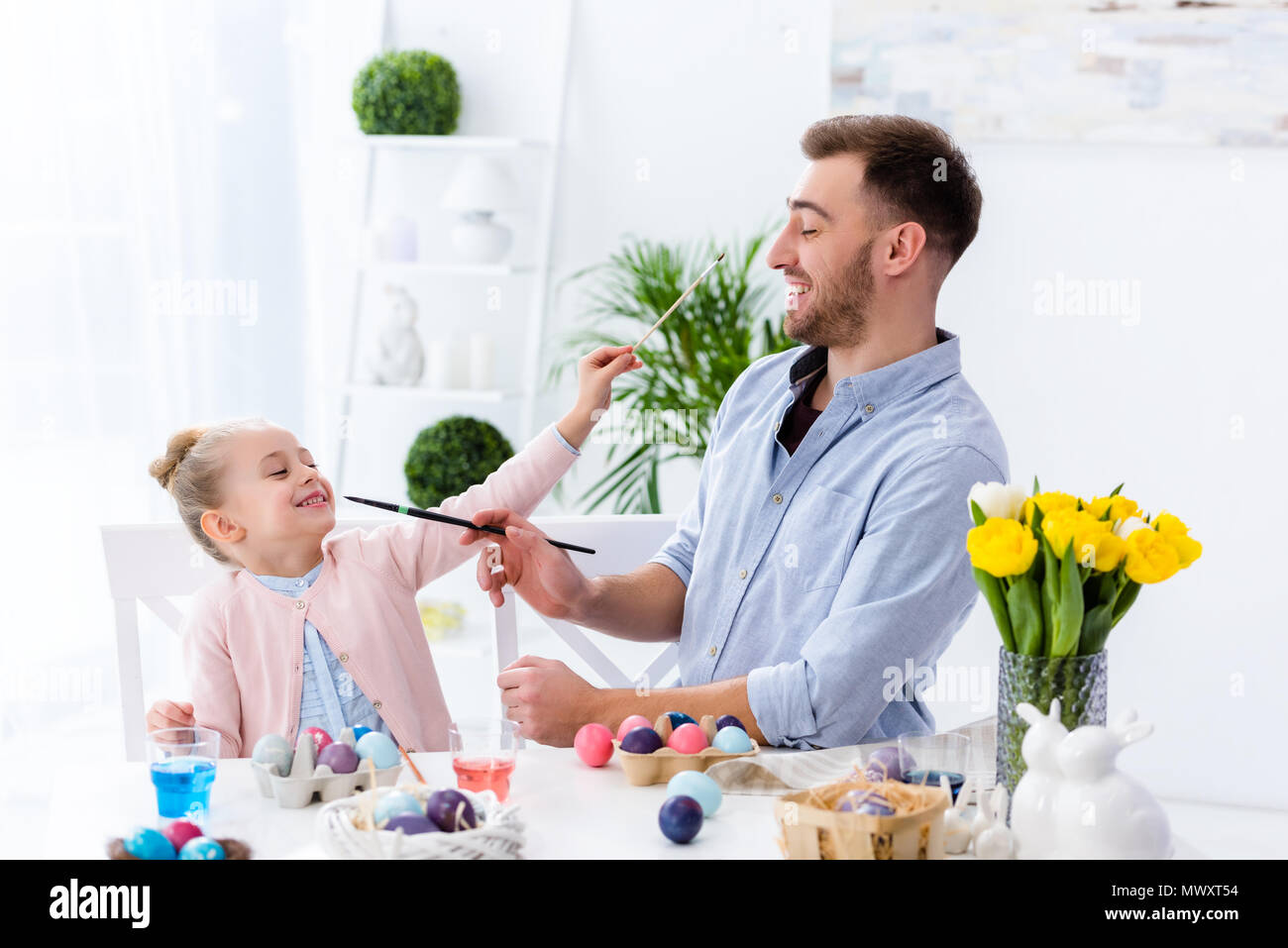 Happy easter father daughter paint hi-res stock photography and images ...