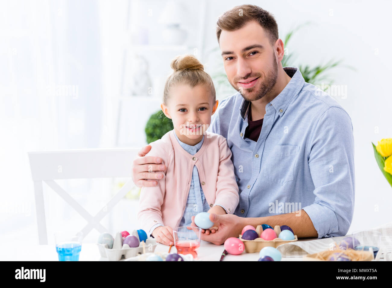 Father and daughter celebrating with Easter eggs Stock Photo - Alamy