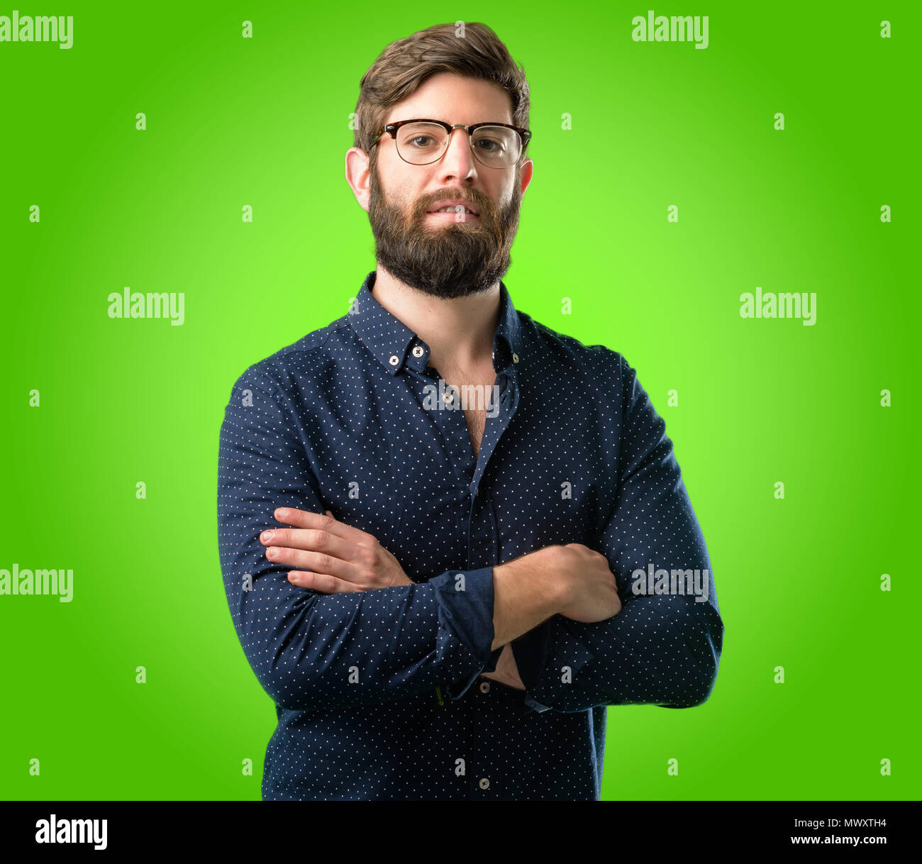 Young hipster man with big beard with crossed arms confident and happy with a big natural smile ...