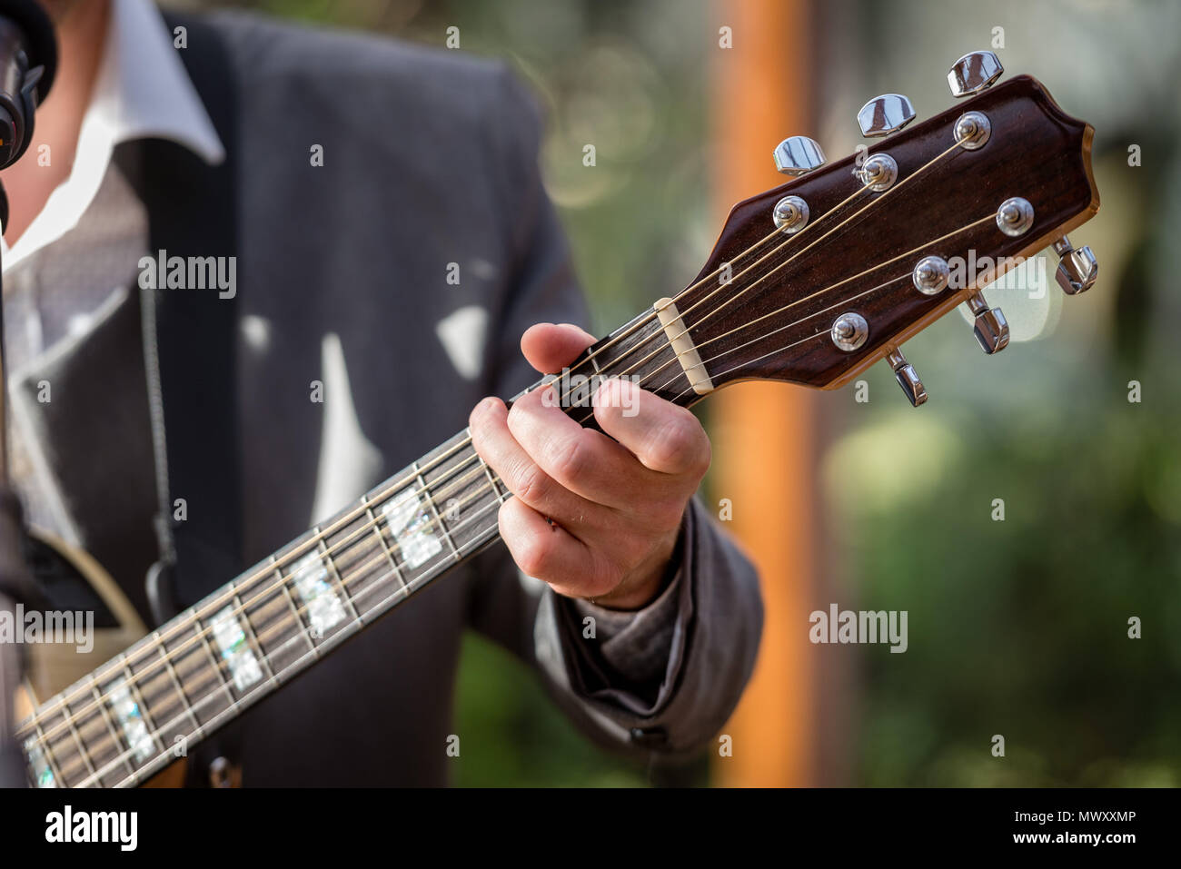 Mans hand playing acoustic guitar hi-res stock photography and images ...
