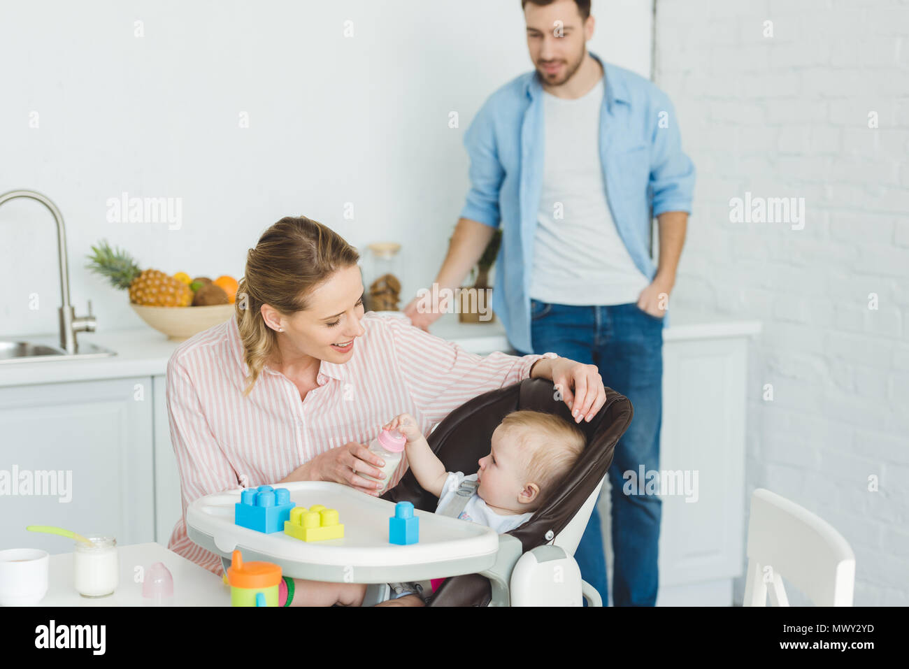 Man standing behind chair hi-res stock photography and images - Alamy