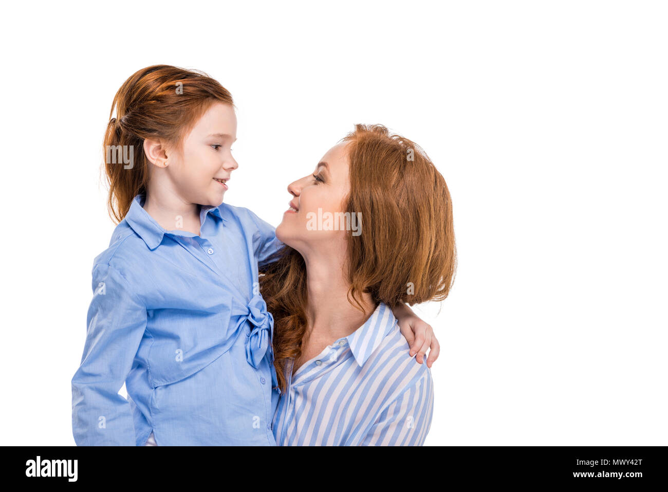 Beautiful Redhead Mother And Daughter Smiling Each Other Isolated On