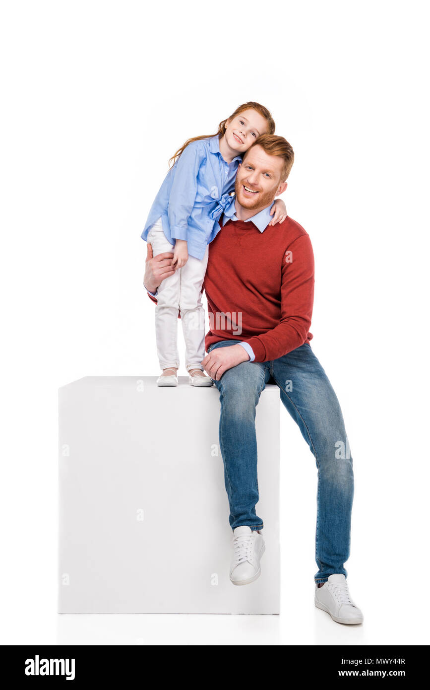 happy red haired father and daughter smiling at camera isolated on ...