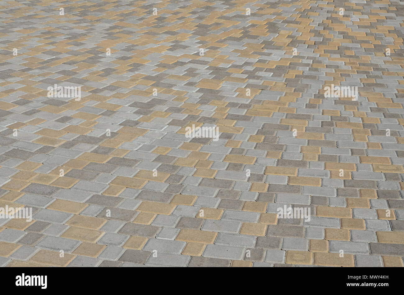 A large area, laid out of paving stone in perspective. Detailed photo ...