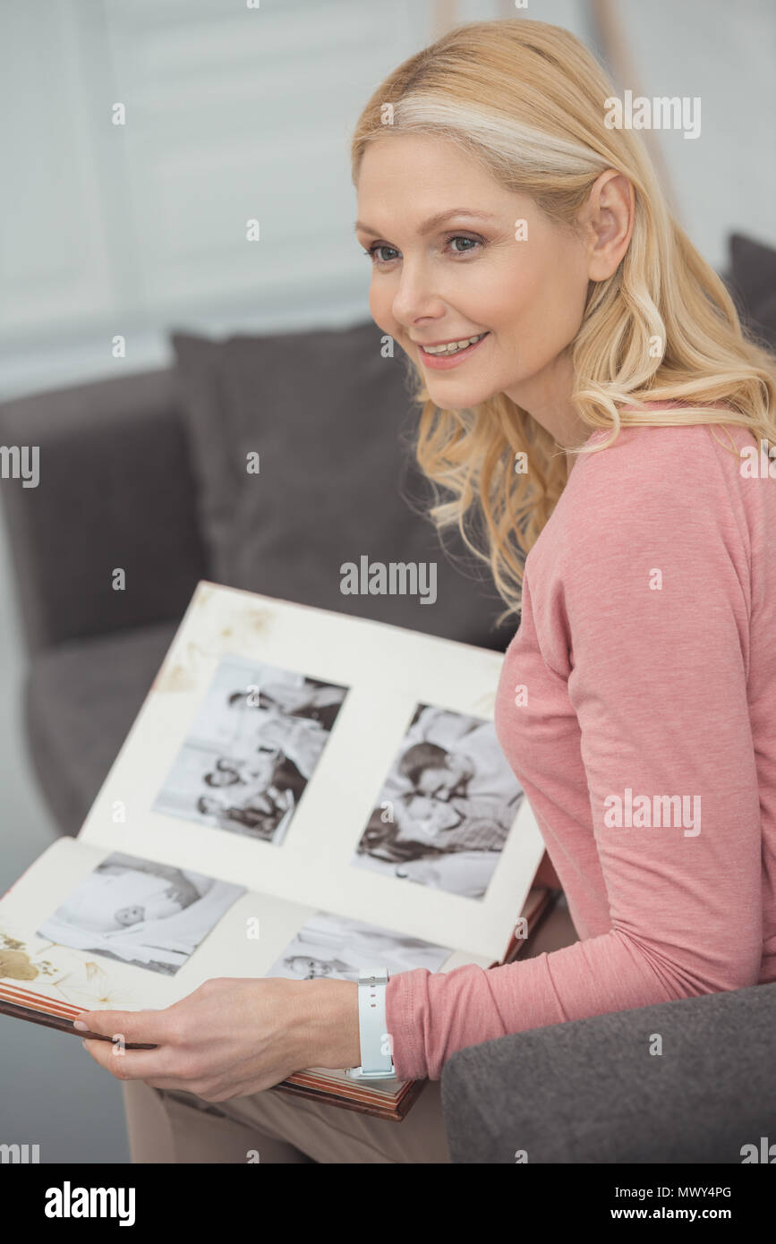 Mature woman and photo album hi-res stock photography and images - Alamy