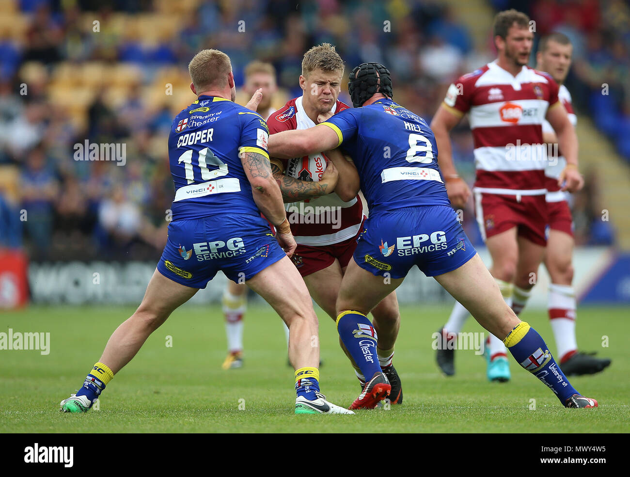 Warrington Wolves Mike Cooper (left) and Chris Hill (right) tackle ...