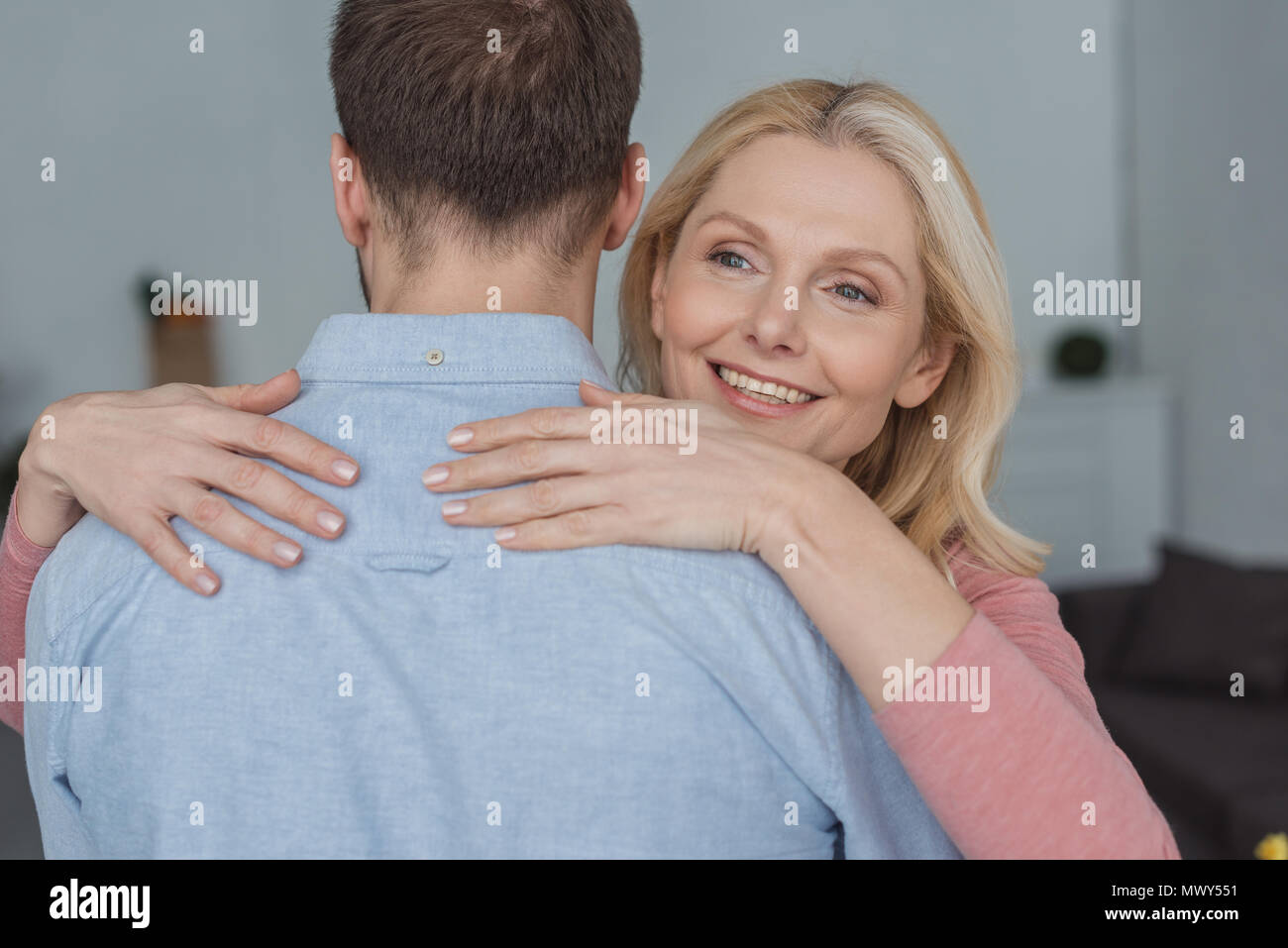 portrait of smiling mother hugging grown son Stock Photo - Alamy