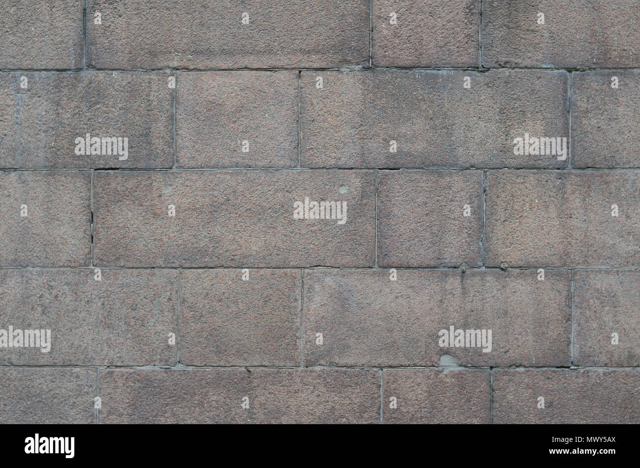 Weathered stained old block wall background. Texture of an old wall of ...