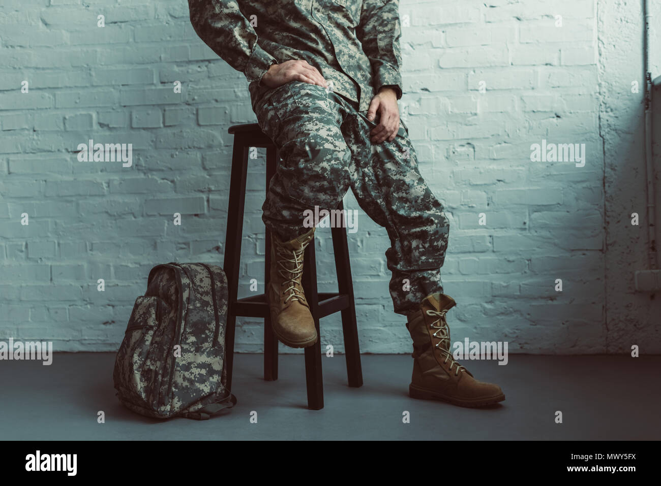 Male soldier sitting in chair hi-res stock photography and images - Alamy