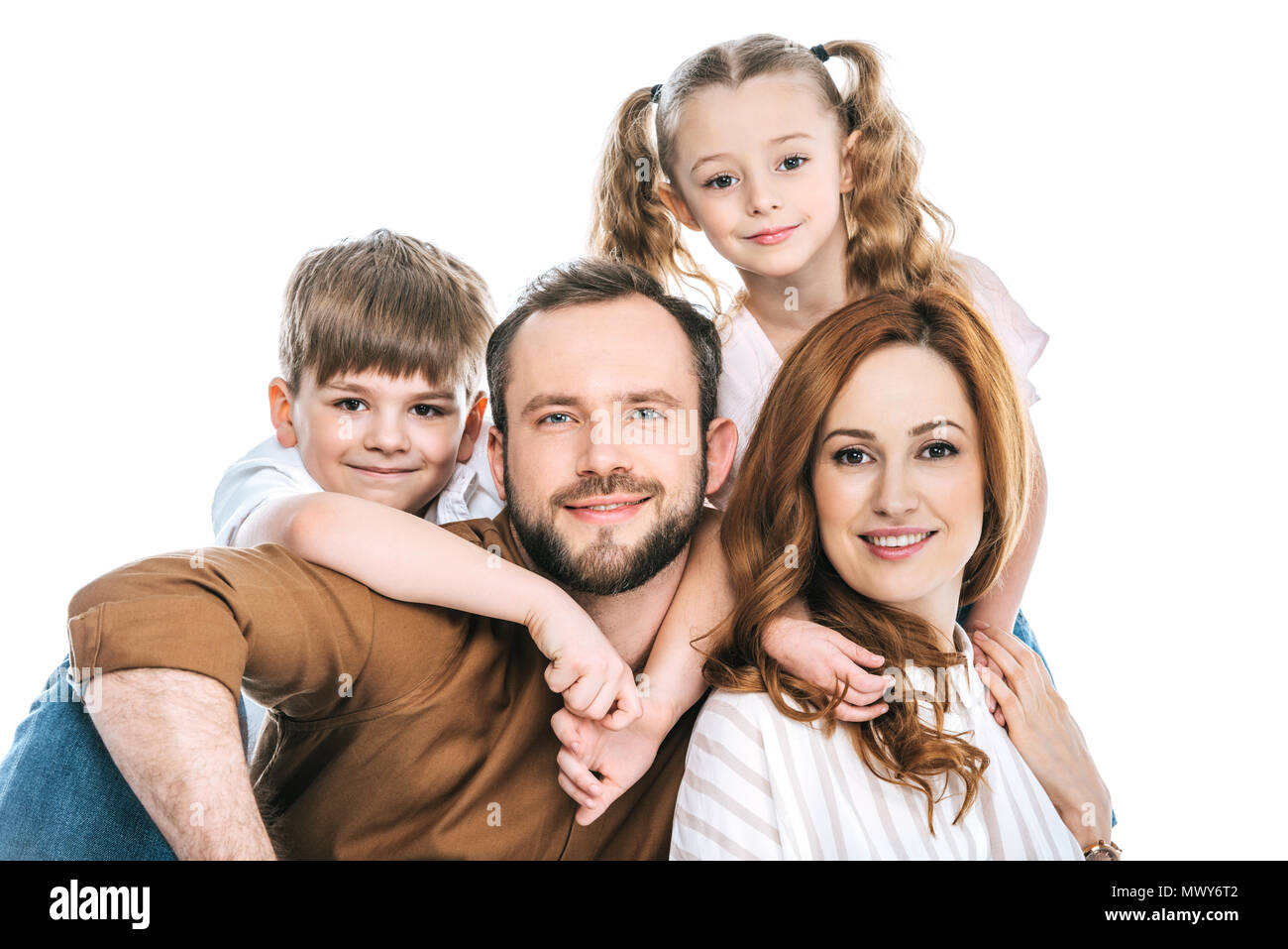 happy family with two children smiling at camera isolated on white ...