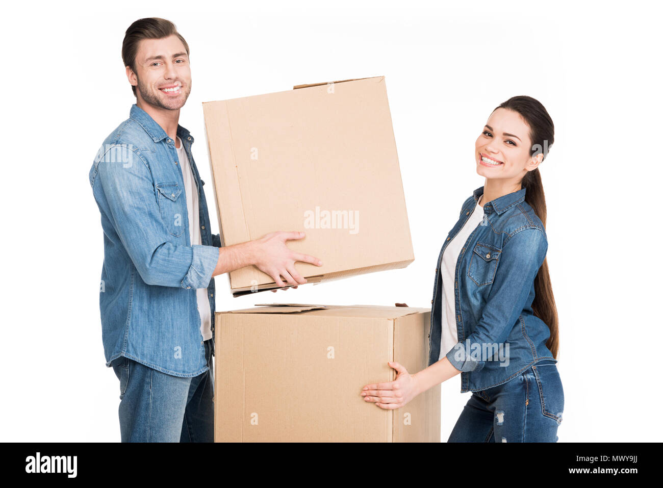 smiling couple carrying cardboard boxes, isolated on white Stock Photo ...