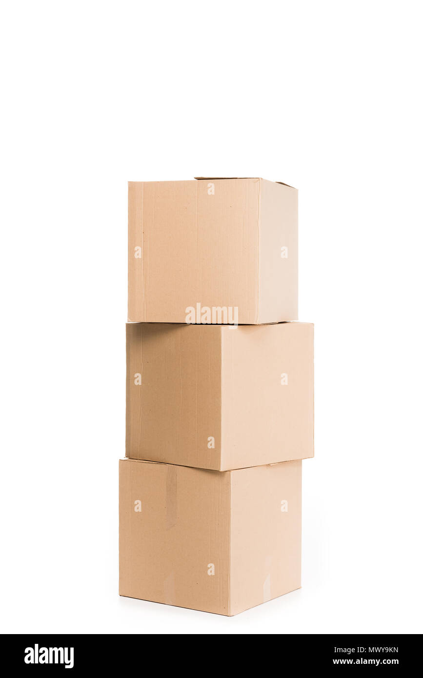 stacked cardboard boxes, isolated on white Stock Photo - Alamy