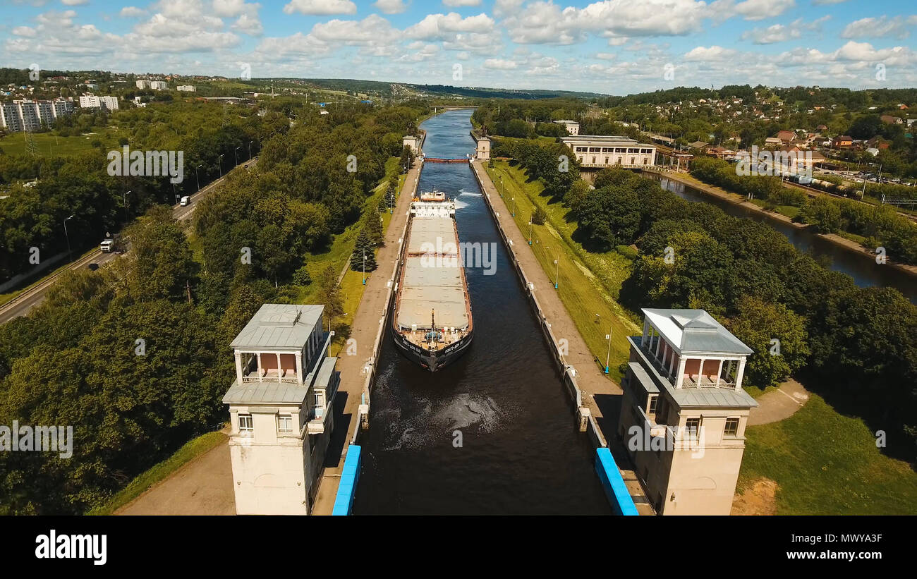 Sluice Gates on the River. Aerial view barge, ship in the river gateway ...