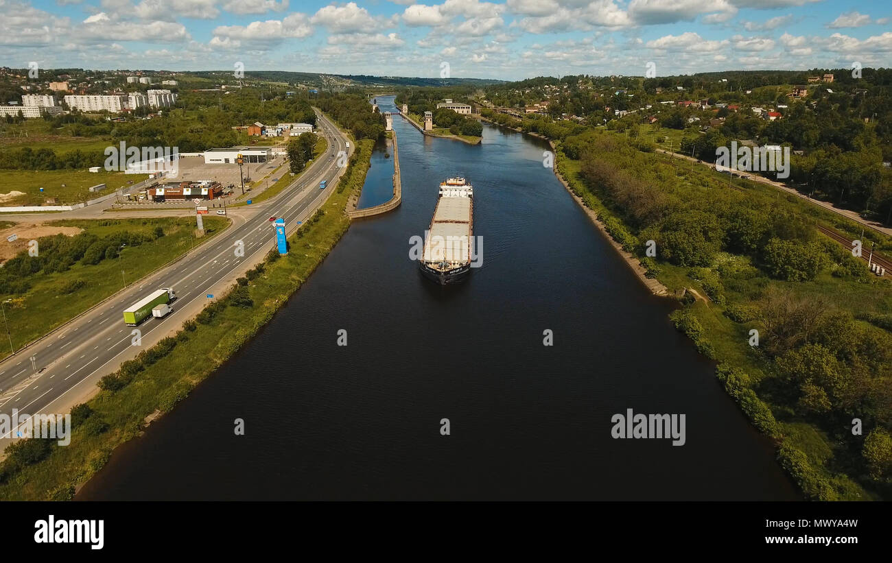 Aerial view:Barge with cargo on the river. River, cargo barge, highway ...