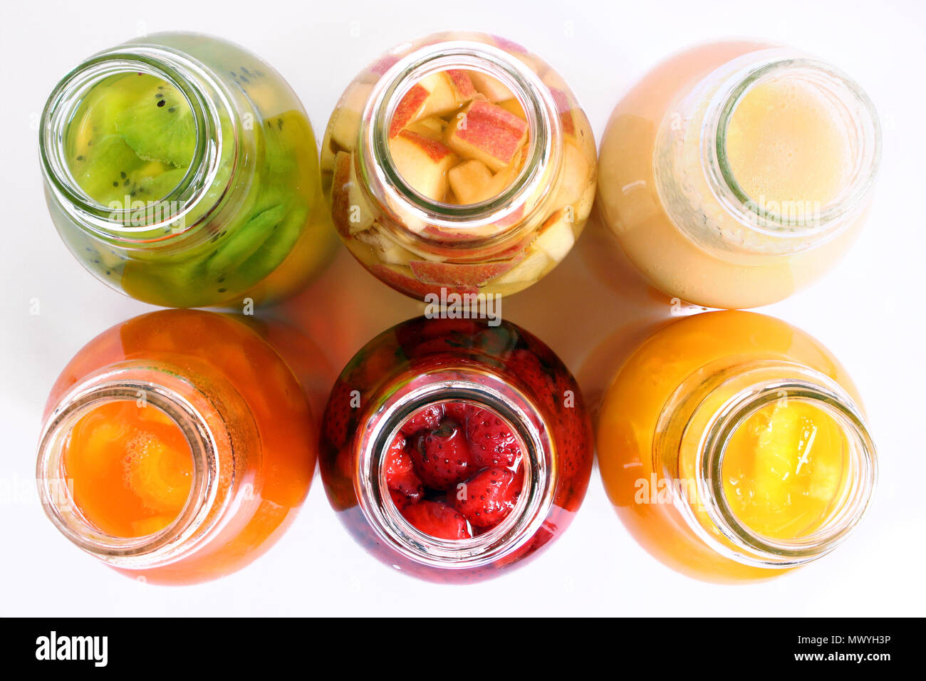 Tropical fruit drinks in glass bottles Stock Photo - Alamy