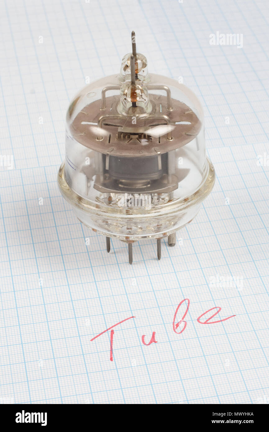 old vacuum tube (electron tube) on graph paper background Stock Photo ...