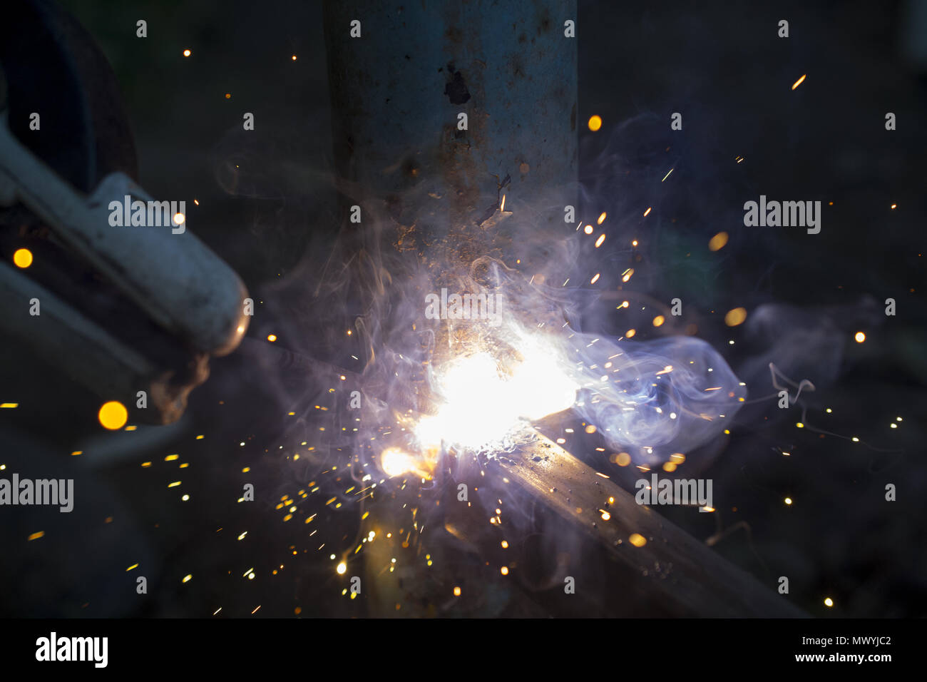 worker welding metal elements on site,image of a Stock Photo - Alamy
