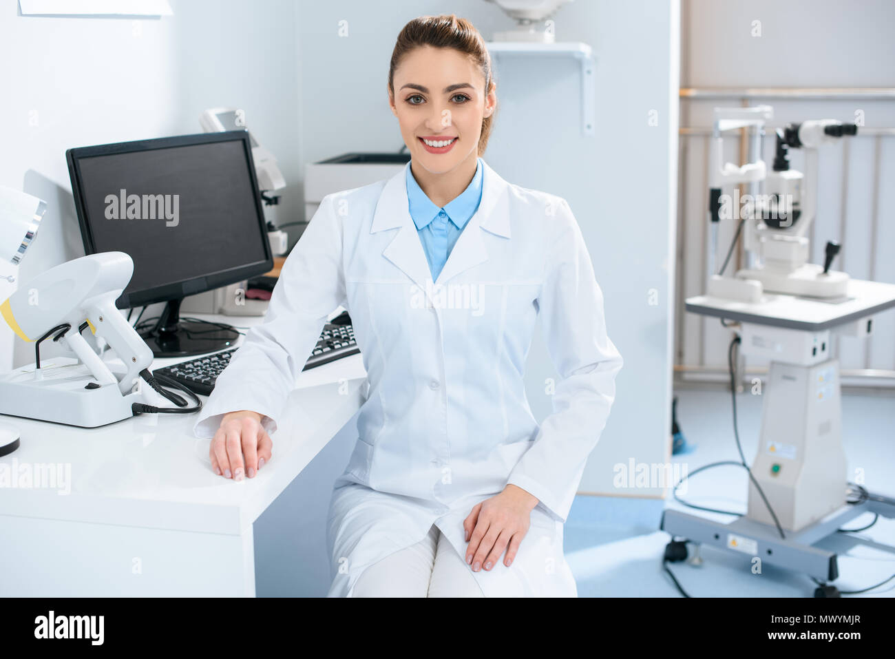 Female ophthalmologist working on computer hi-res stock photography and ...