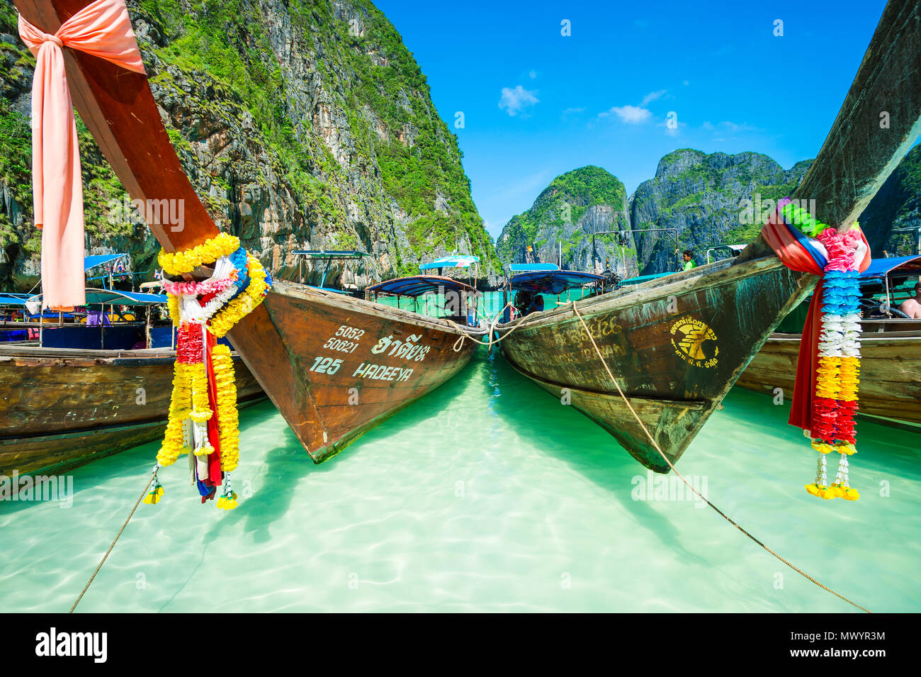 MAYA BAY, THAILAND - NOVEMBER 12, 2014: Thai longtail boats decorated ...