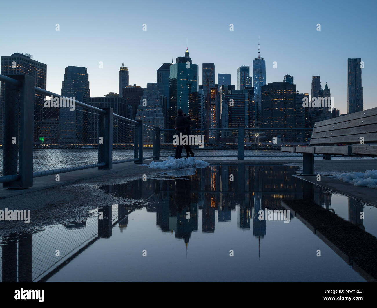 Manhattan skyline at dusk reflecting in a pond Stock Photo - Alamy