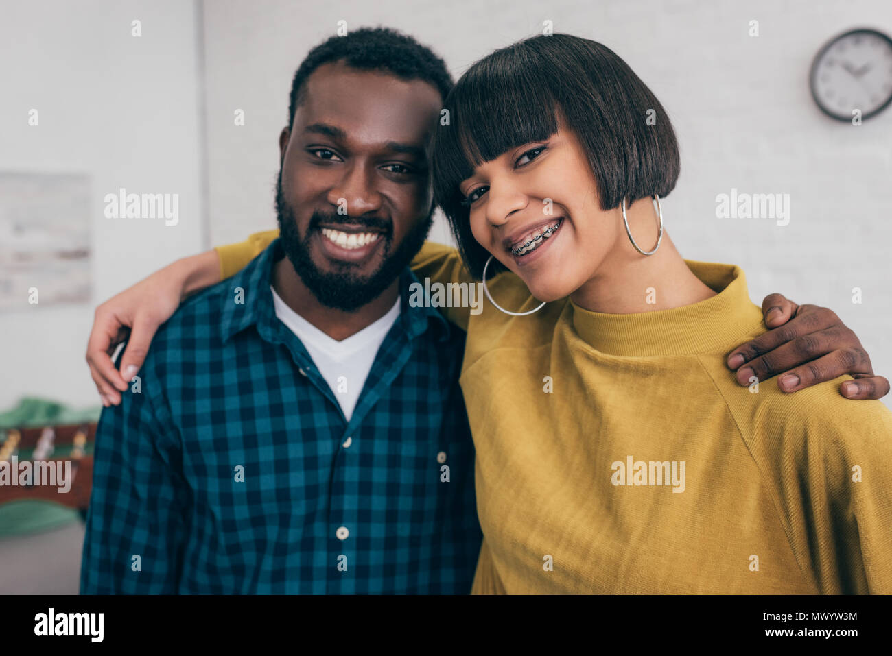portrait of young multicultural couple embracing each other Stock Photo ...