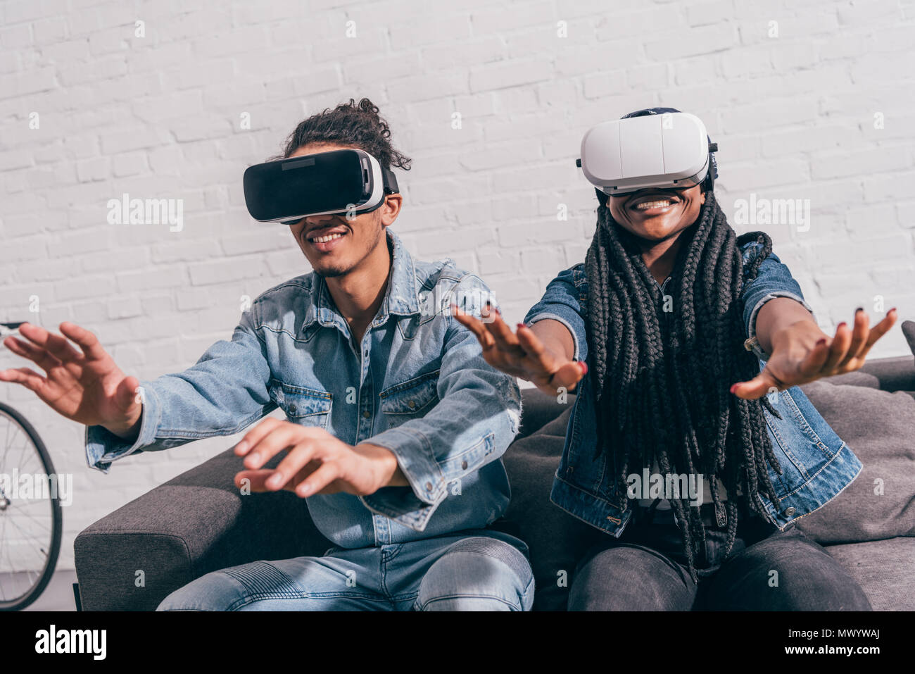 Multicultural friends using virtual hi-res stock photography and images ...