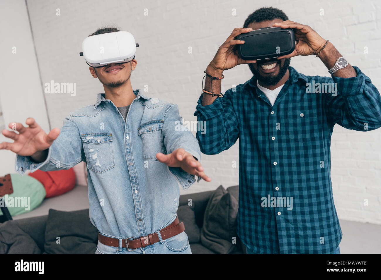 Multicultural friends using virtual hi-res stock photography and images ...