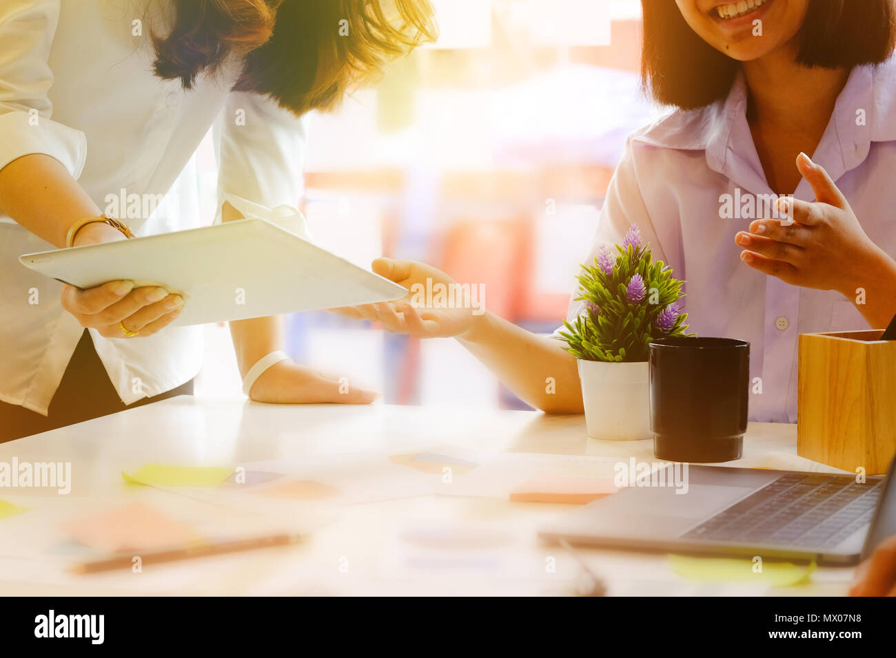 Cropped shot working woman meeting and consult with tablet computer on ...