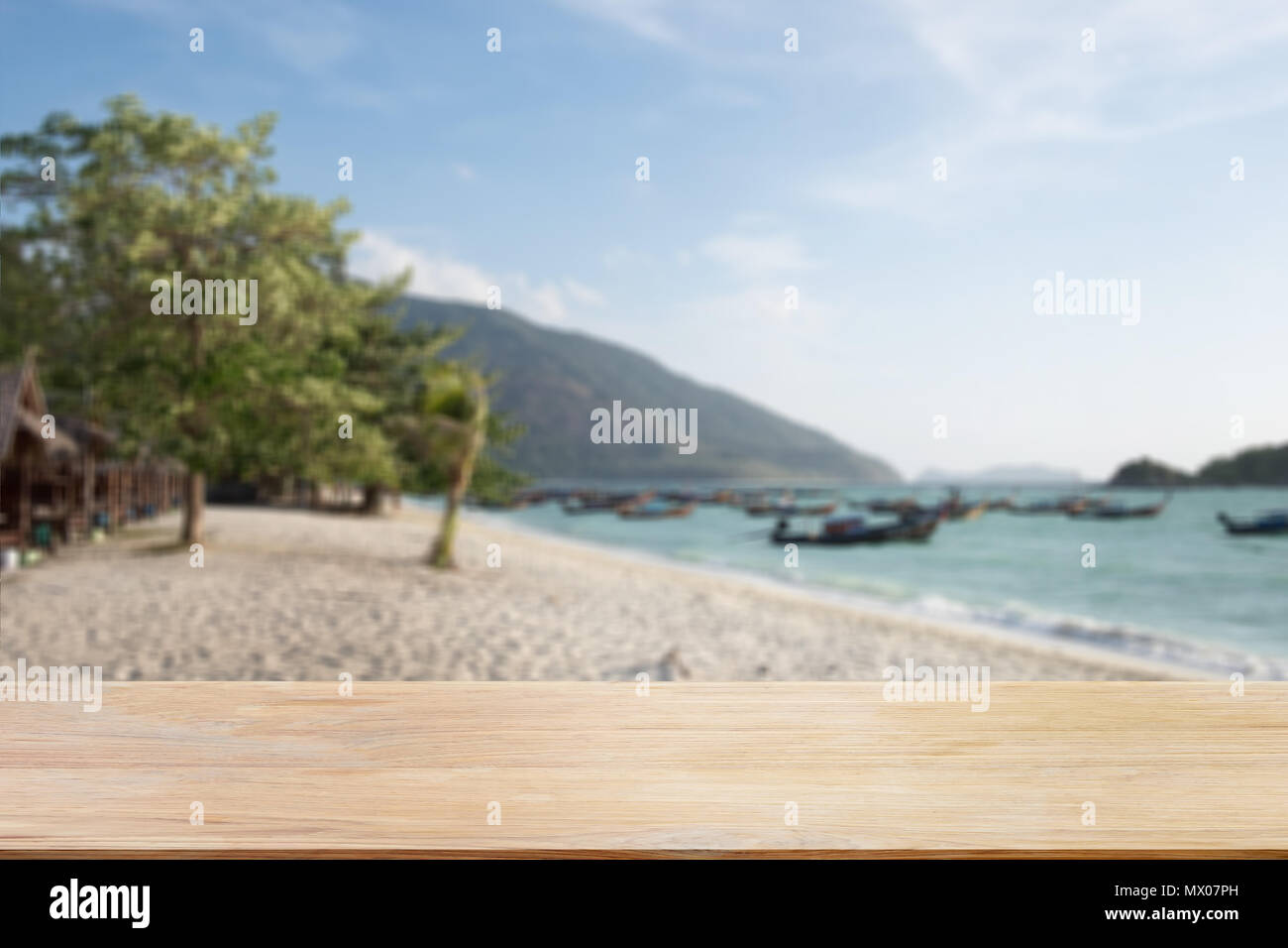 Wooden table with sea beach on background Stock Photo - Alamy