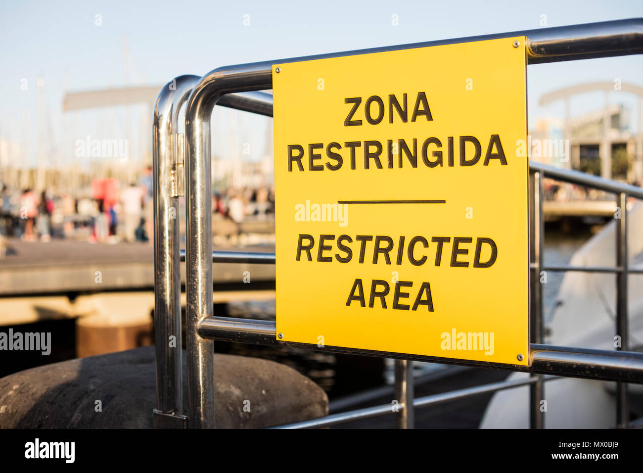 Restricted area signboard, written in Spanish and English Stock Photo ...