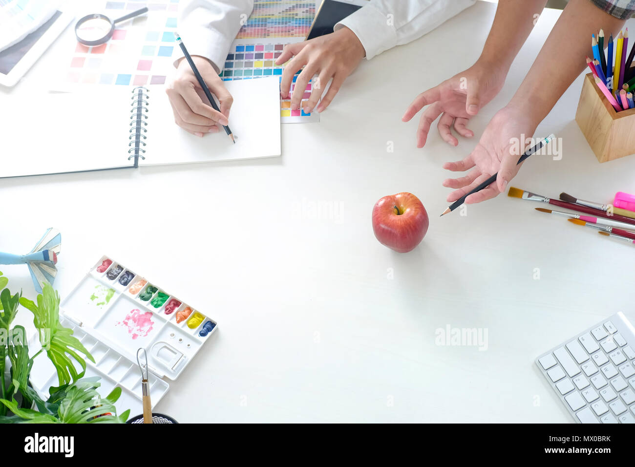 Artist meeting on workplace with closeup shot photo Stock Photo - Alamy
