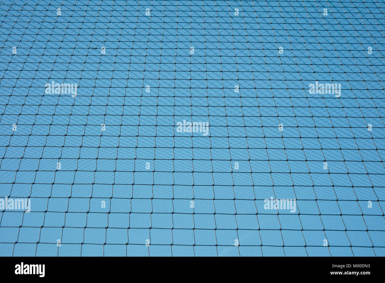 Net with blue sky background Stock Photo - Alamy