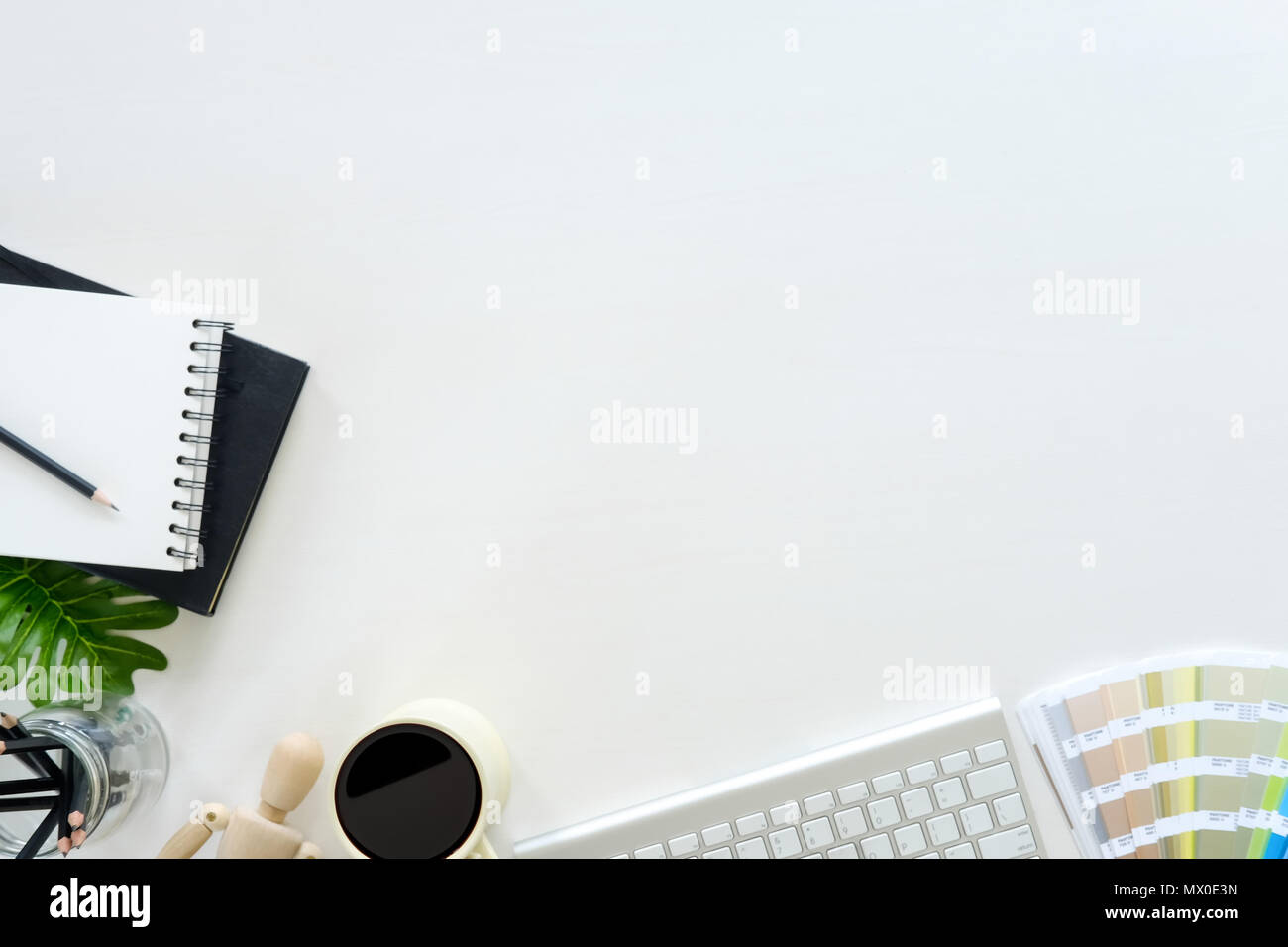 Top view office desk with designer table a Pantone, computer, coffee ...