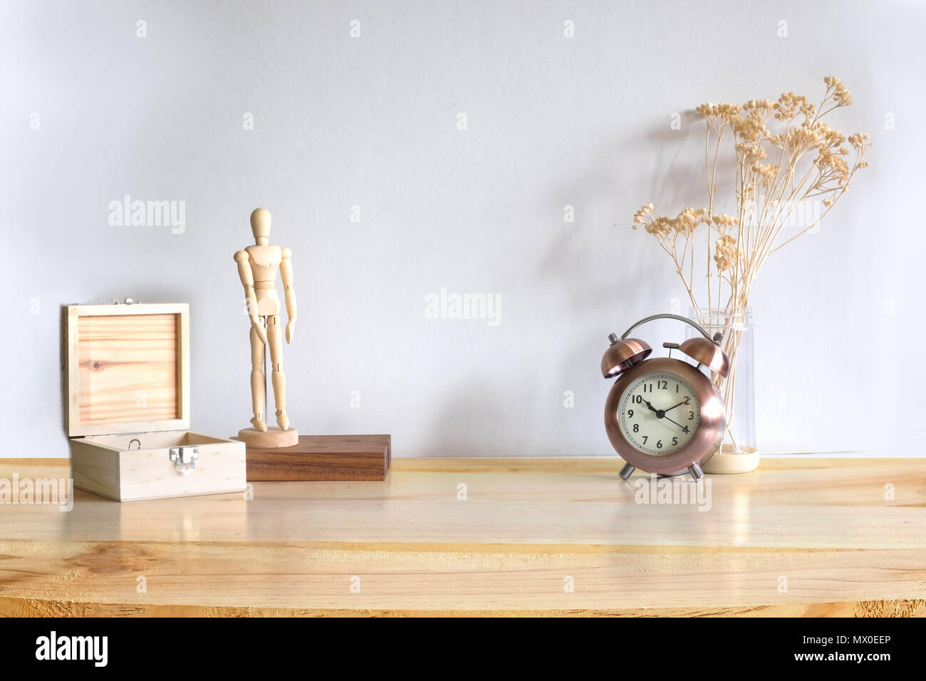 Workspace wooden object box, model wooden toy, alarm and dry plant on ...