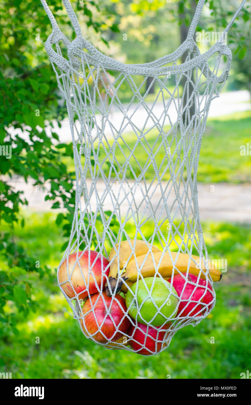 Trendy string bag with fruits. Shopping bag. Trendy closeup for ...
