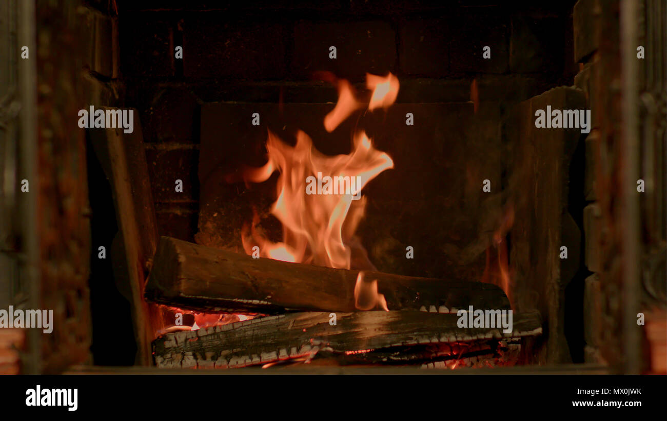 A nice fire in a fire place. Professional shot in 4K resolution. You ...