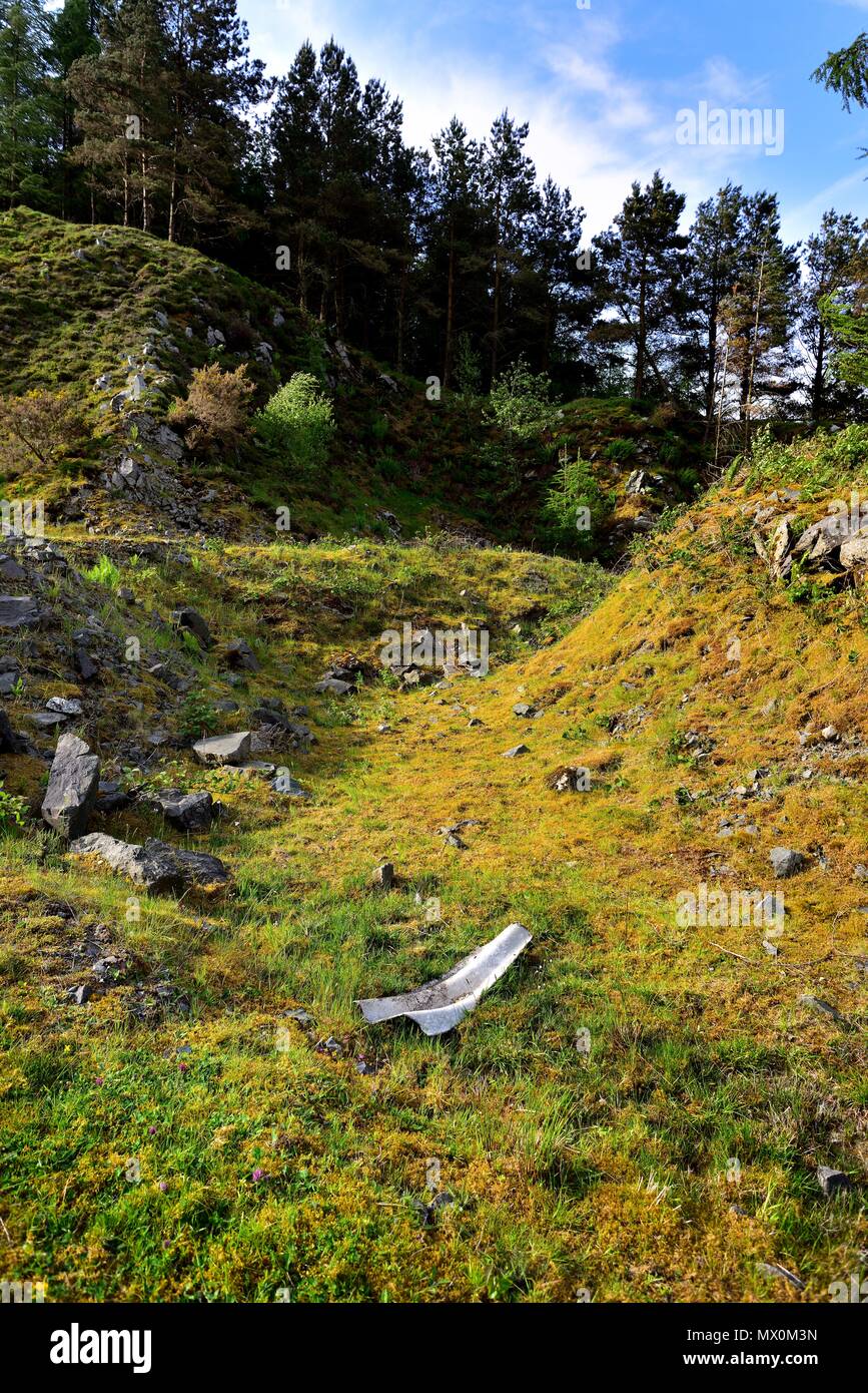 Discarded curved asbestos debris in the quarry Stock Photo - Alamy