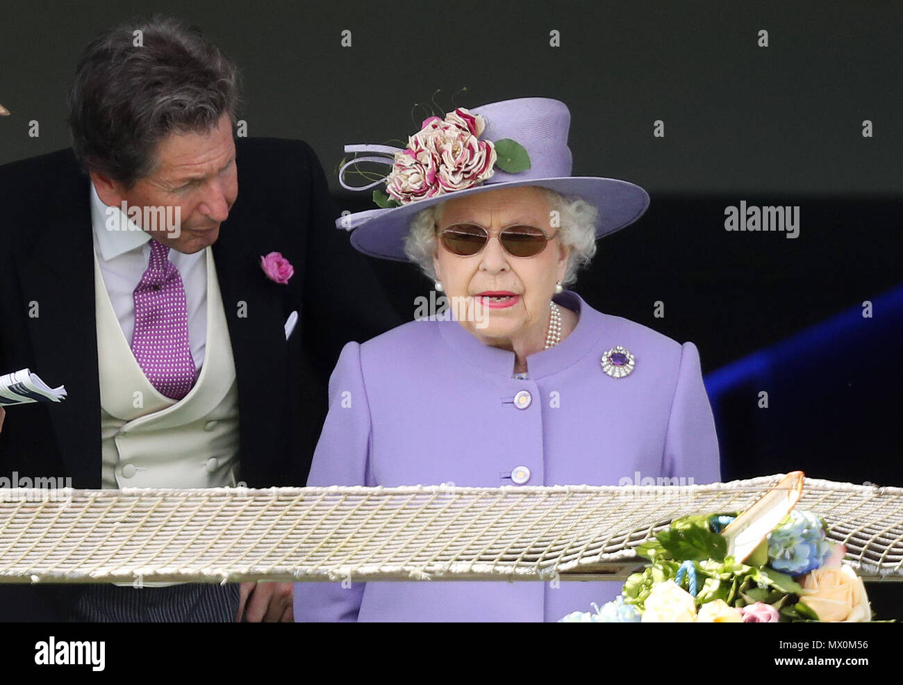 Queen Elizabeth II with racing manager John Warren during derby day of ...