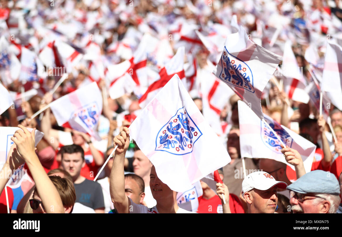 England fans in the stands wave flags during the International Friendly ...