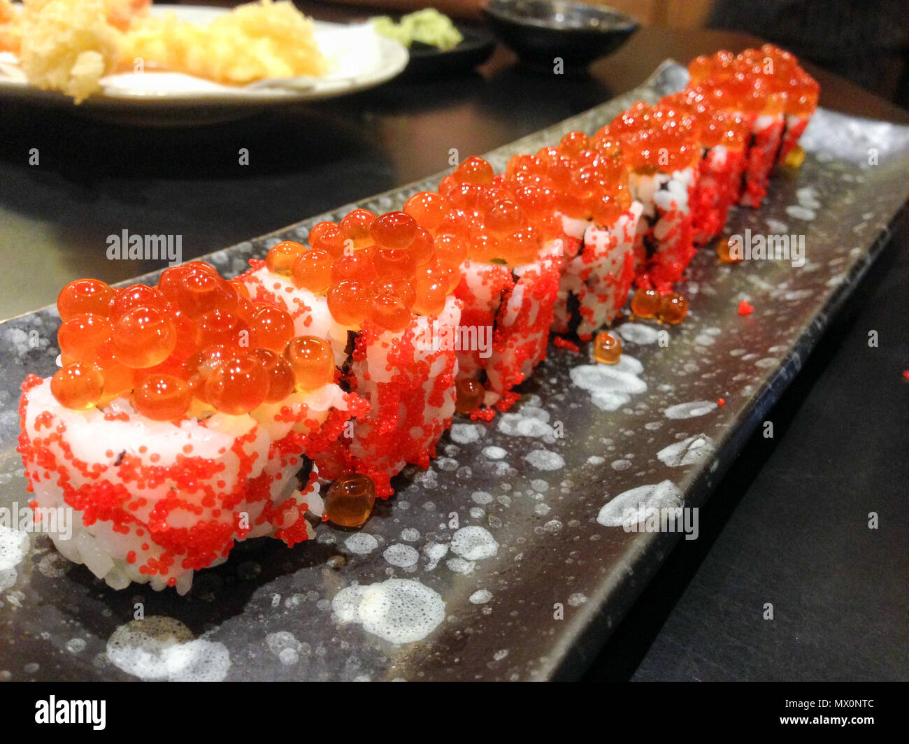 Sushi roll in flying fish roe hi-res stock photography and images - Alamy