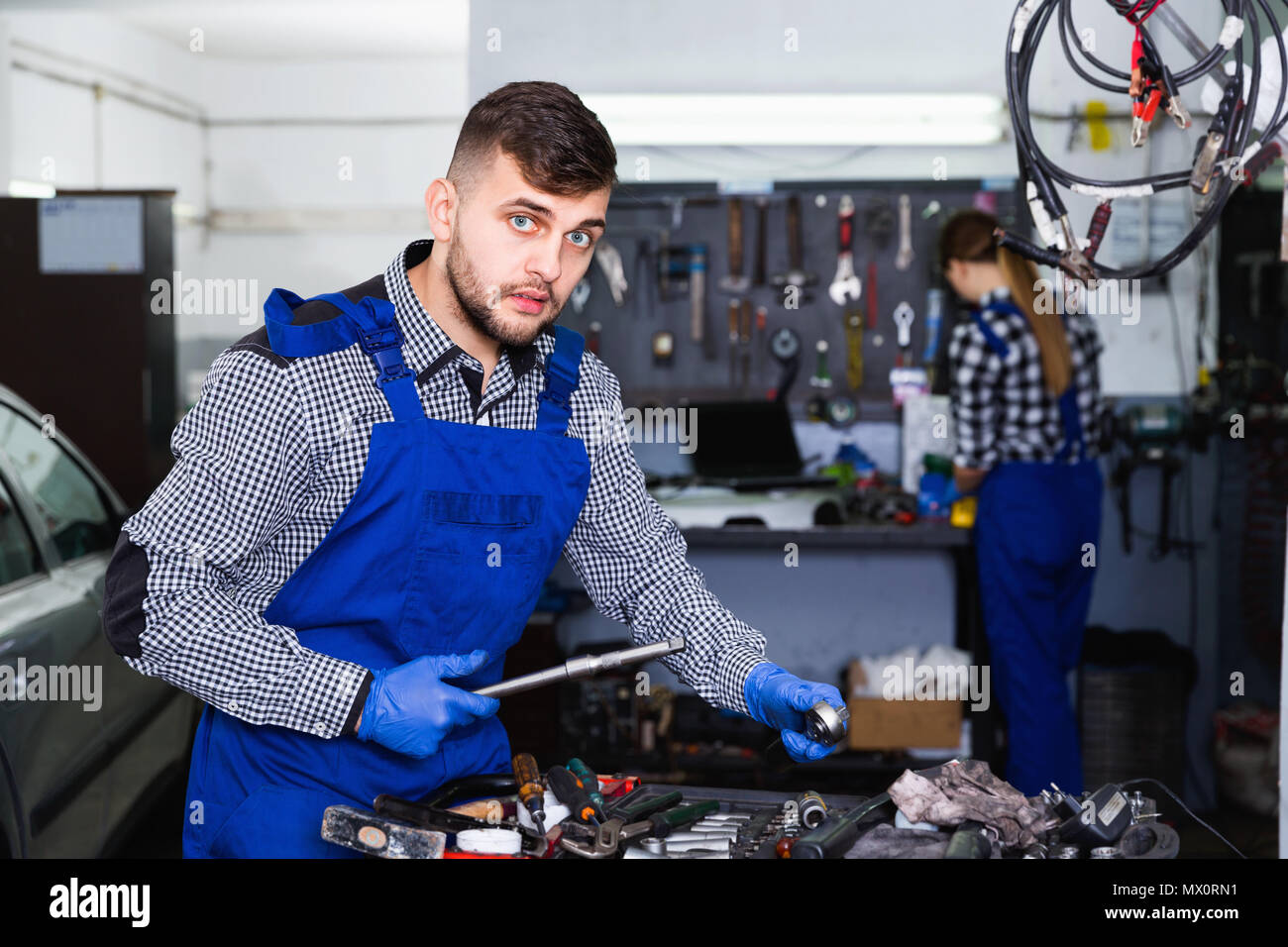 Male worker choosing instruments hi-res stock photography and images ...