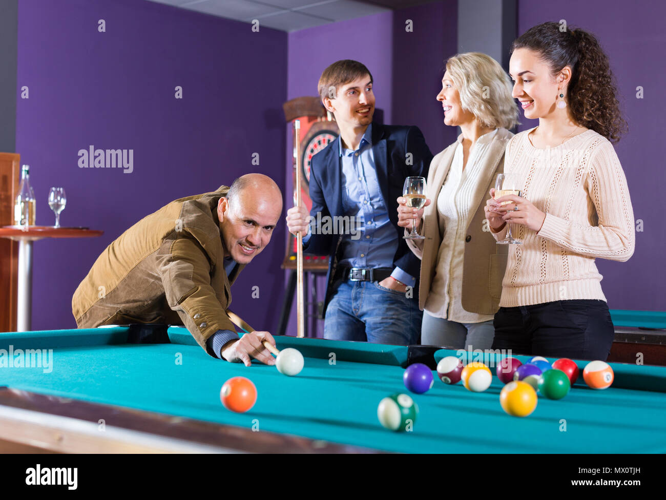 Happy couples playing billiards hi-res stock photography and images - Alamy