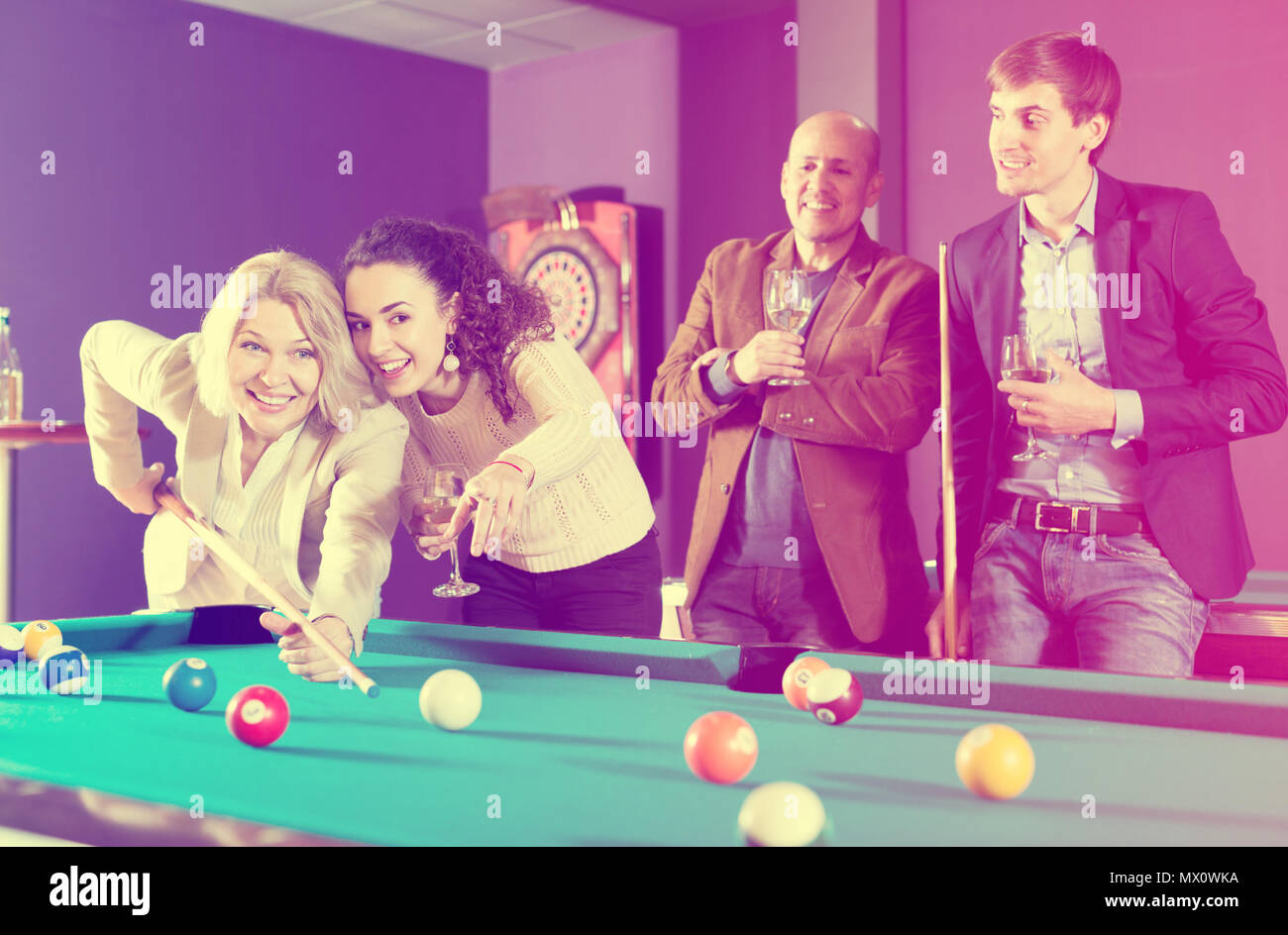 Happy couples playing billiards hi-res stock photography and images - Alamy