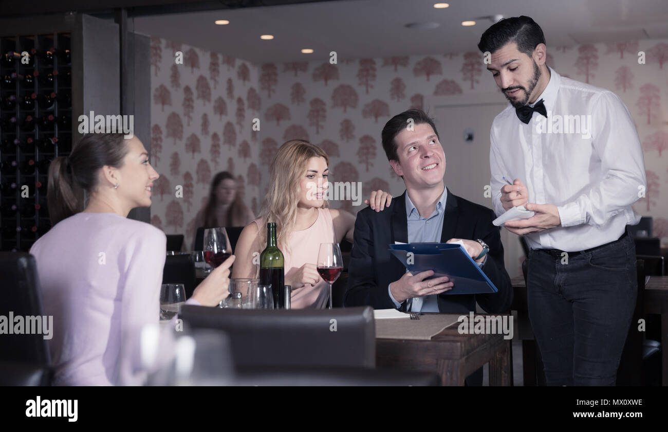 Waiter recommending wine hi-res stock photography and images - Alamy
