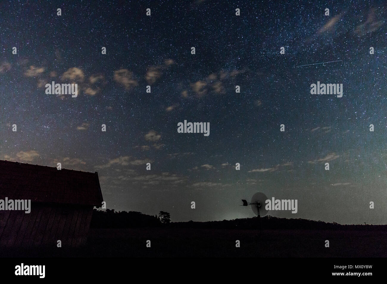 windmill milkyway cottage galaxy stars universe Stock Photo - Alamy