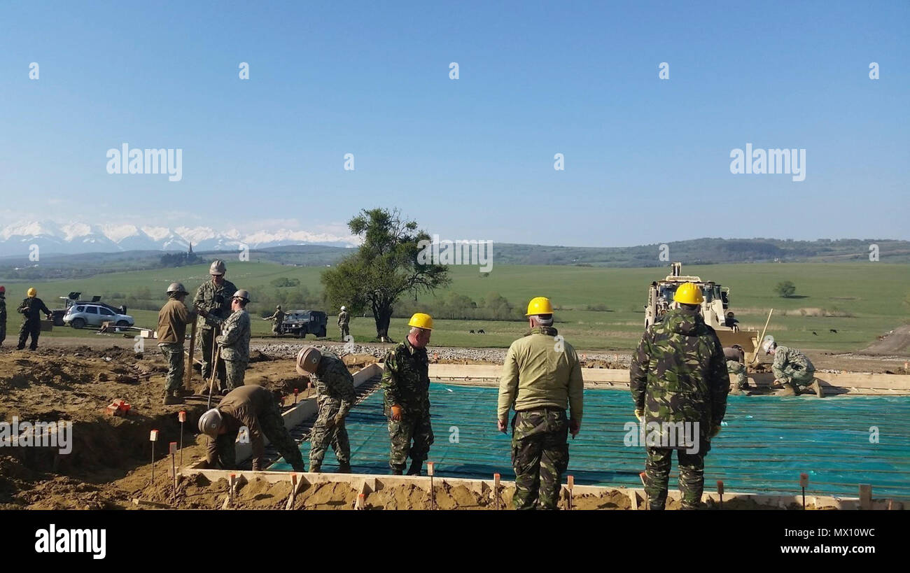 Sailors from the Naval Mobile Construction Battalion 1 work with ...