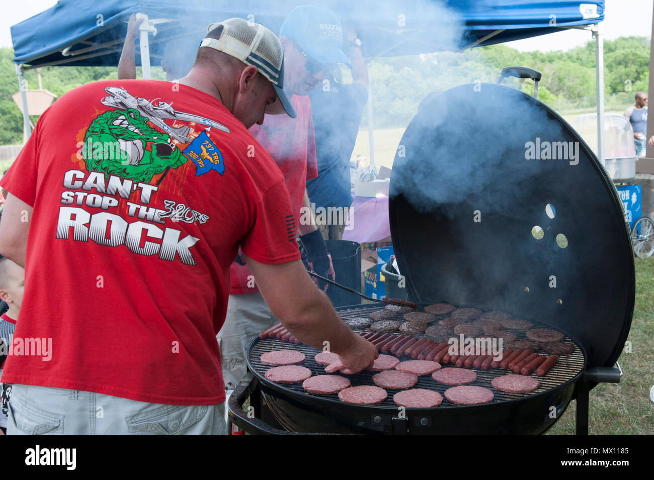 Members of the 320th Training Squadron, grill various meats at the Air ...