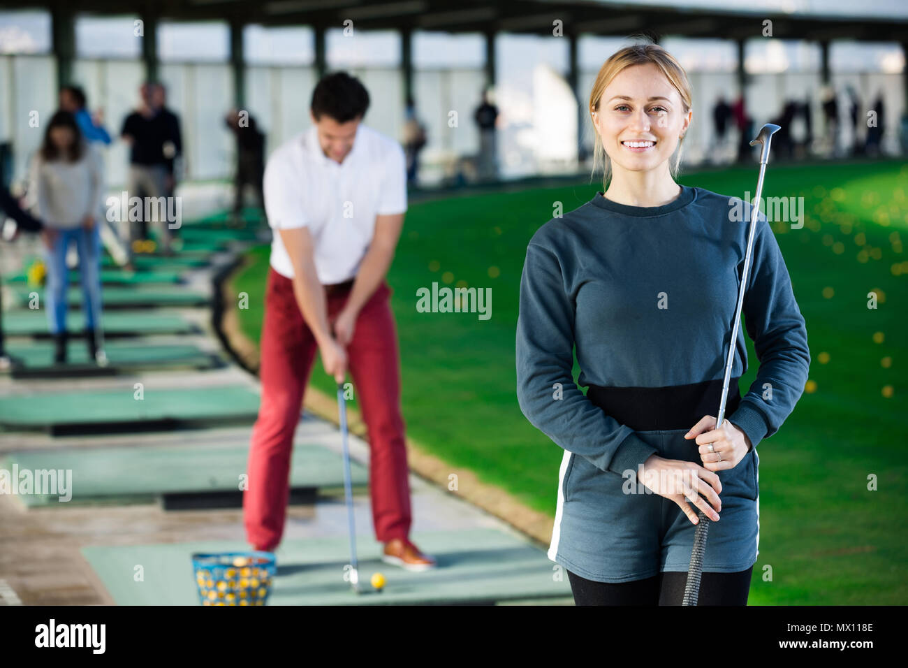 happy woman golf player is ready to enjoy game at golf course Stock ...