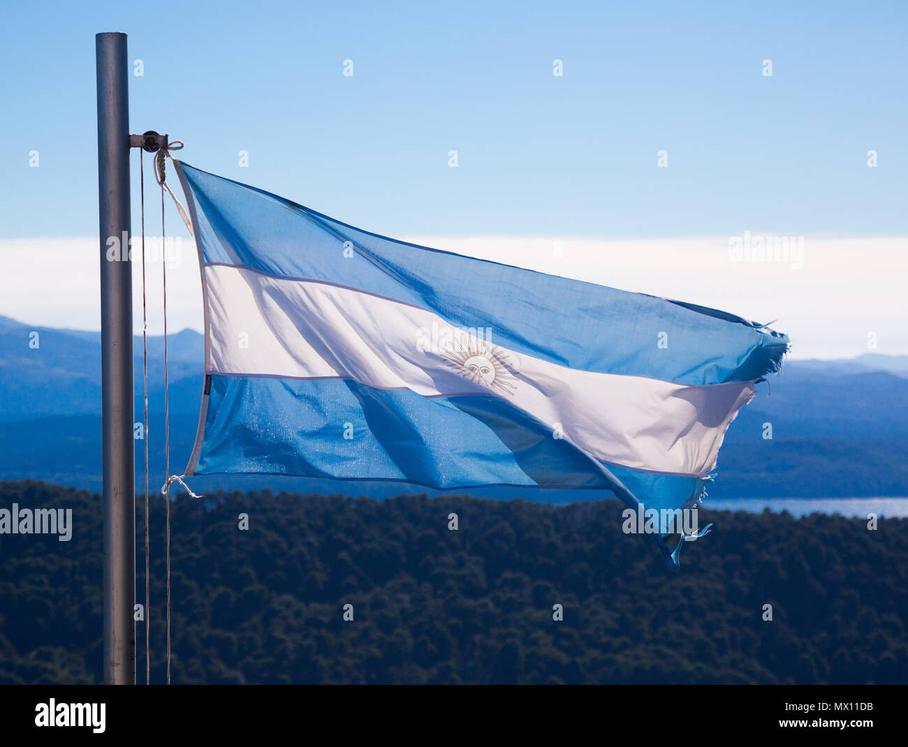 Blue and white national flag of Argentina raised on flagstaff ...