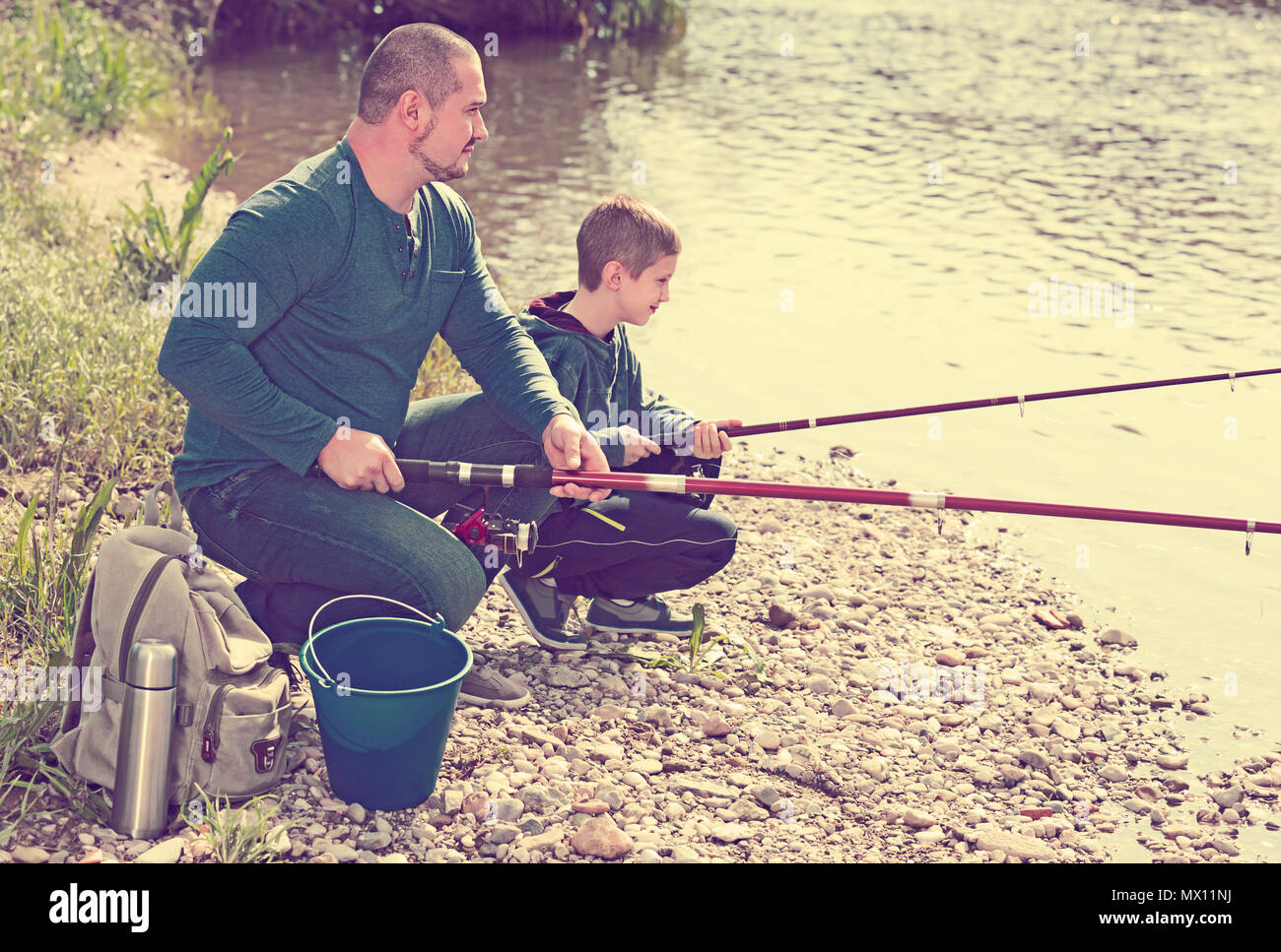 Father boy fishing rods hi-res stock photography and images - Alamy